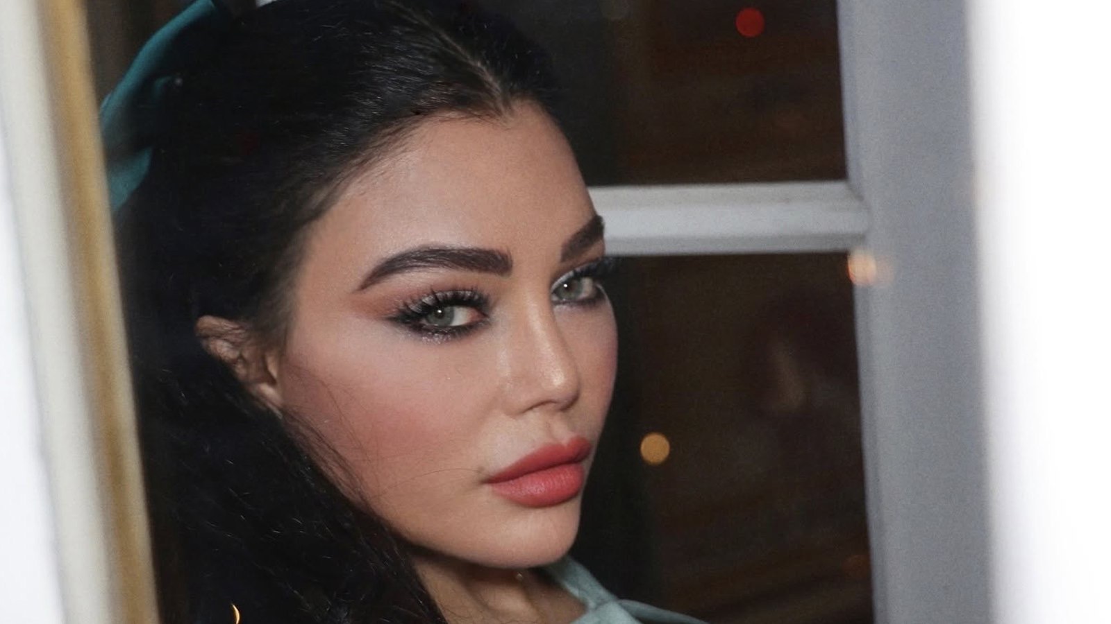 Haifa Wehbe flaunts her glamorous look amidst a luxurious, classic decor.